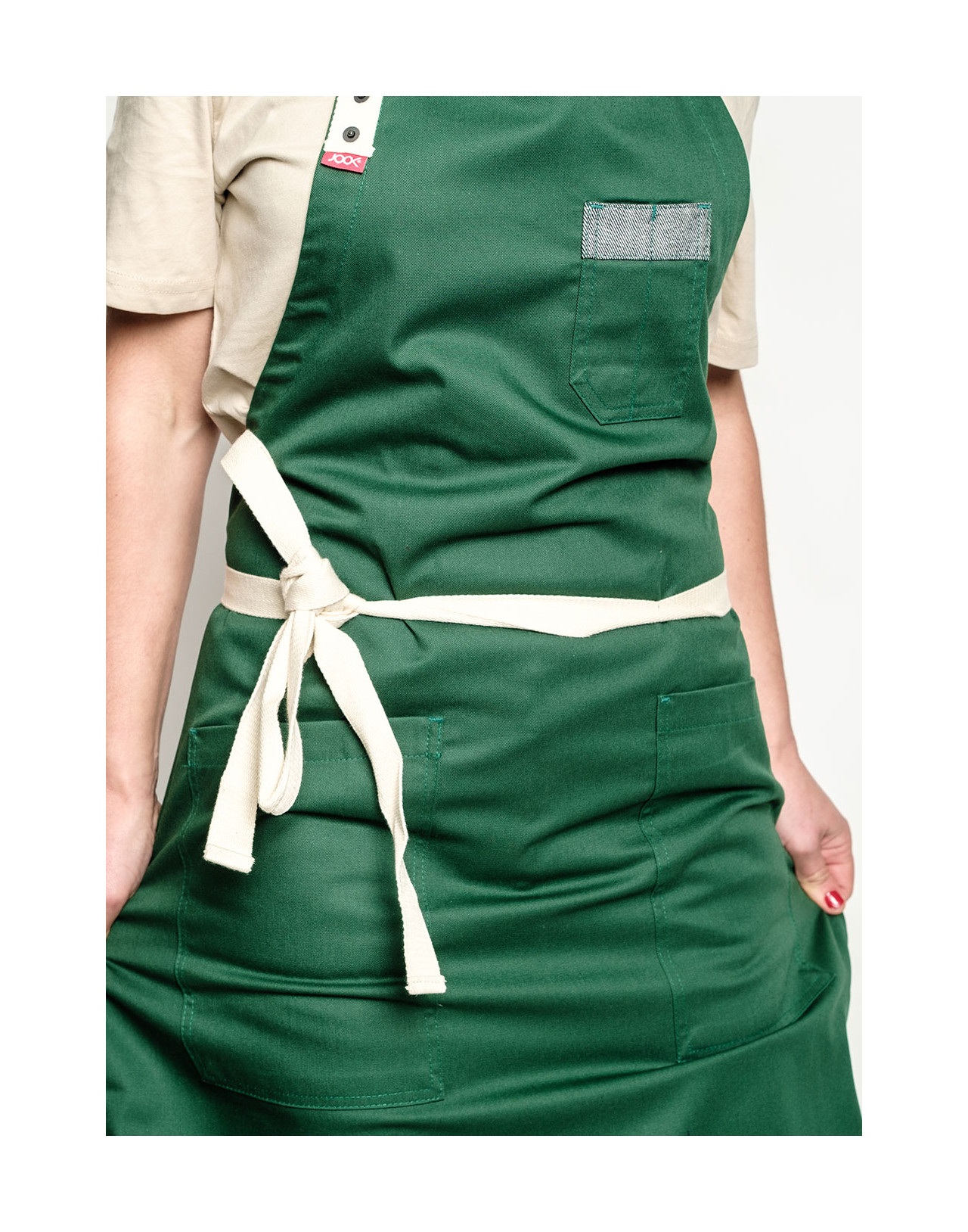 Green chef apron with white straps
